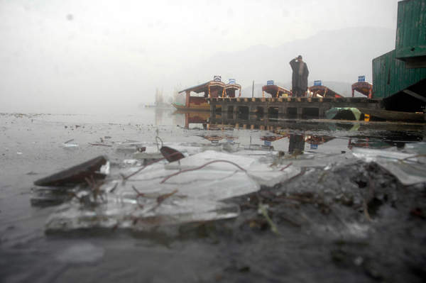 A view of ice sheets formed on the water of Dal Lake, which was ...