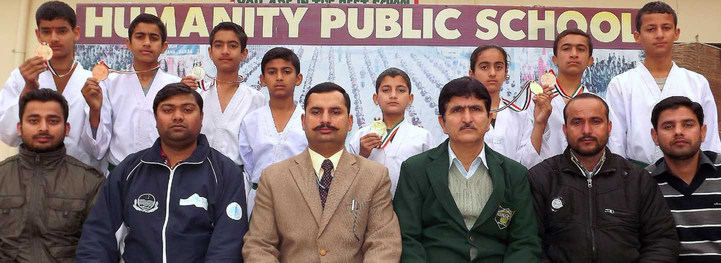Medal winners of Humanity Public School posing for a photograph along ...