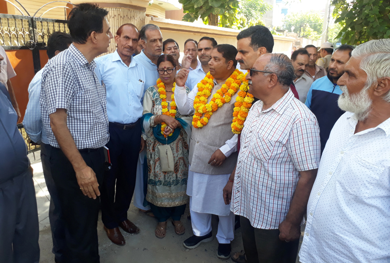 Former Minister & MLA Jammu West, Sat Sharma interacting with officers ...