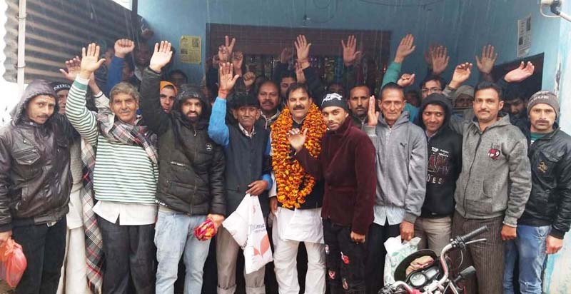 JKNPP chairman Harsh Dev Singh posing with supporters in Ramnagar ...