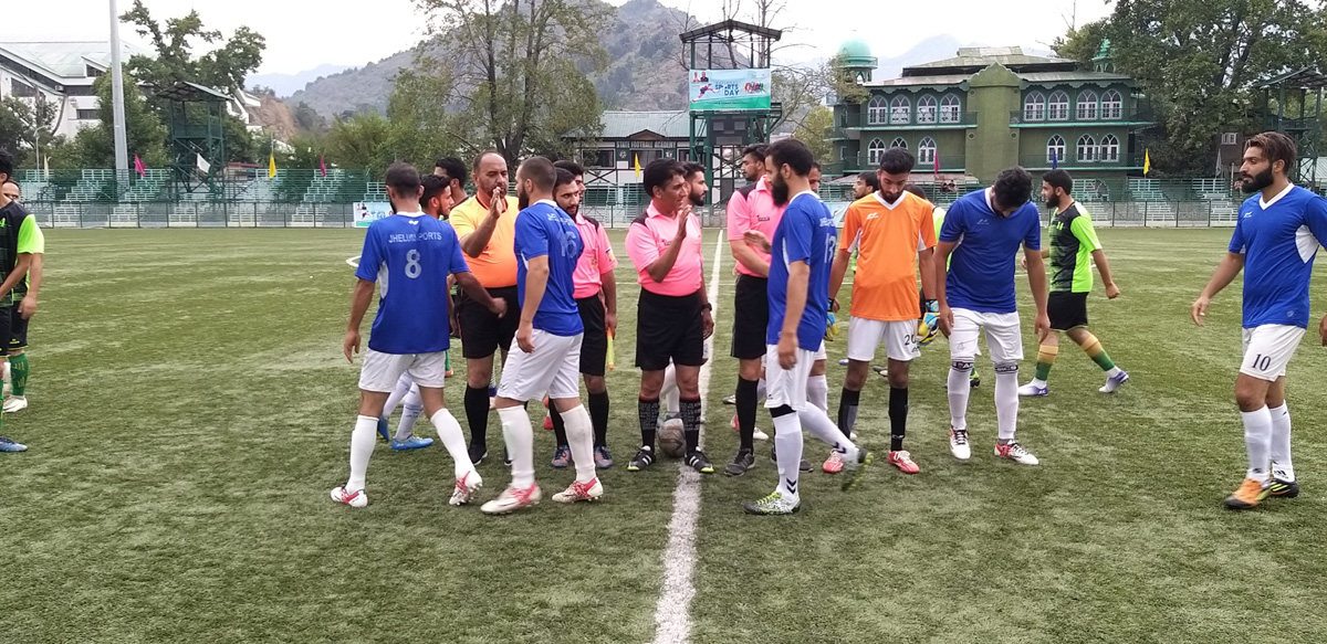 Players interacting with referees before the match at TRC Ground ...