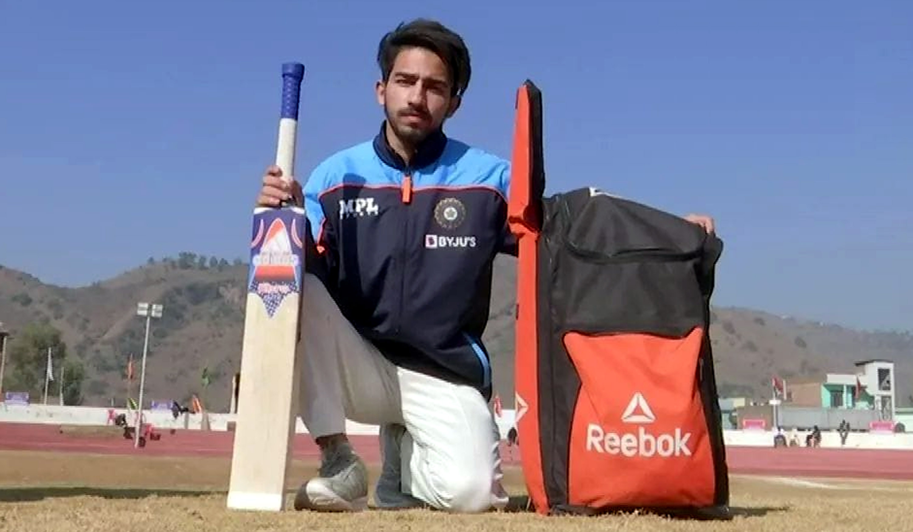 Winners displaying medals while posing with dignitaries at MA Stadium ...