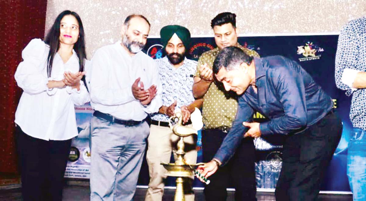 Chief guest lighting lamps during inaugural ceremony of District level ...